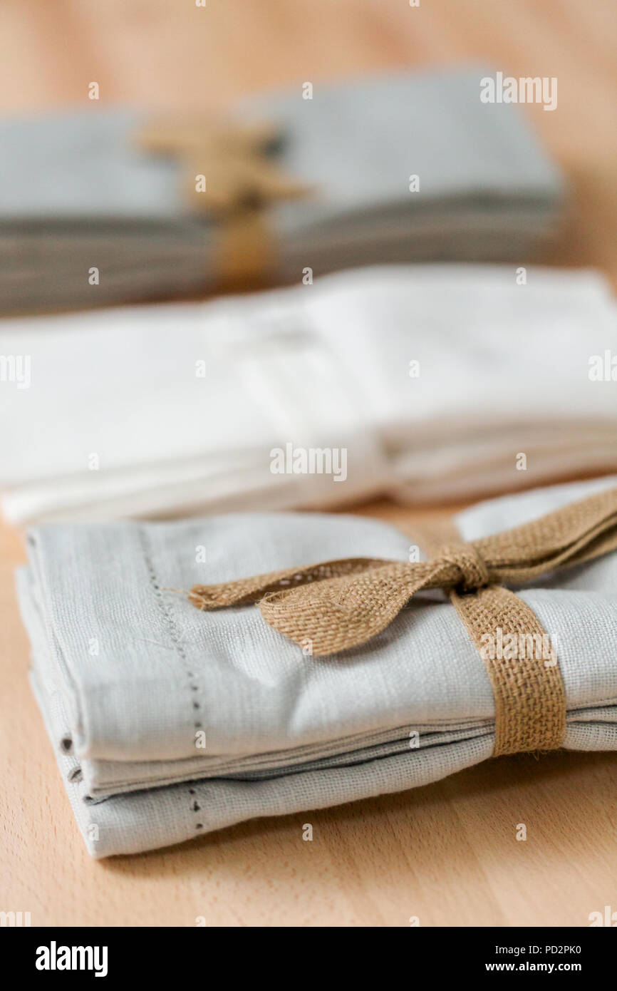 Stack of new linen dinner napkin on the kitchen counter Stock Photo - Alamy