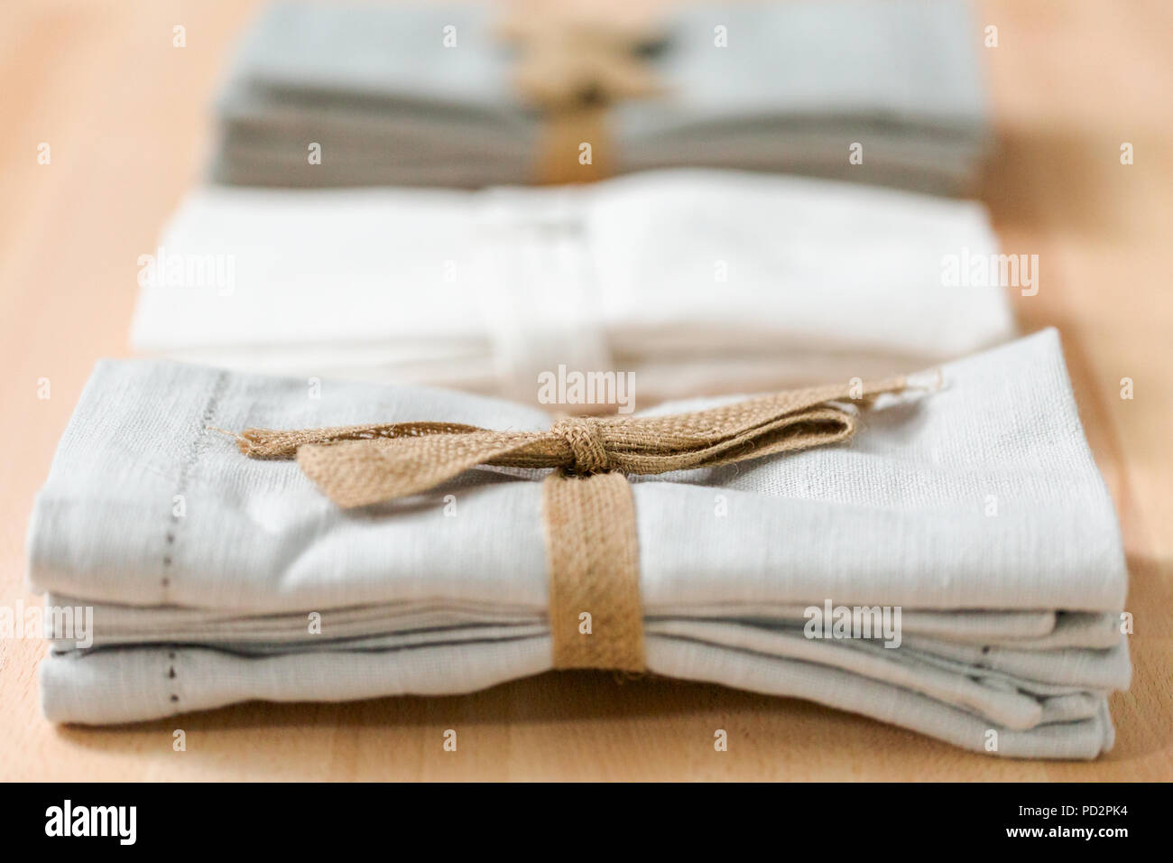 Stack of new linen dinner napkin on the kitchen counter Stock Photo - Alamy