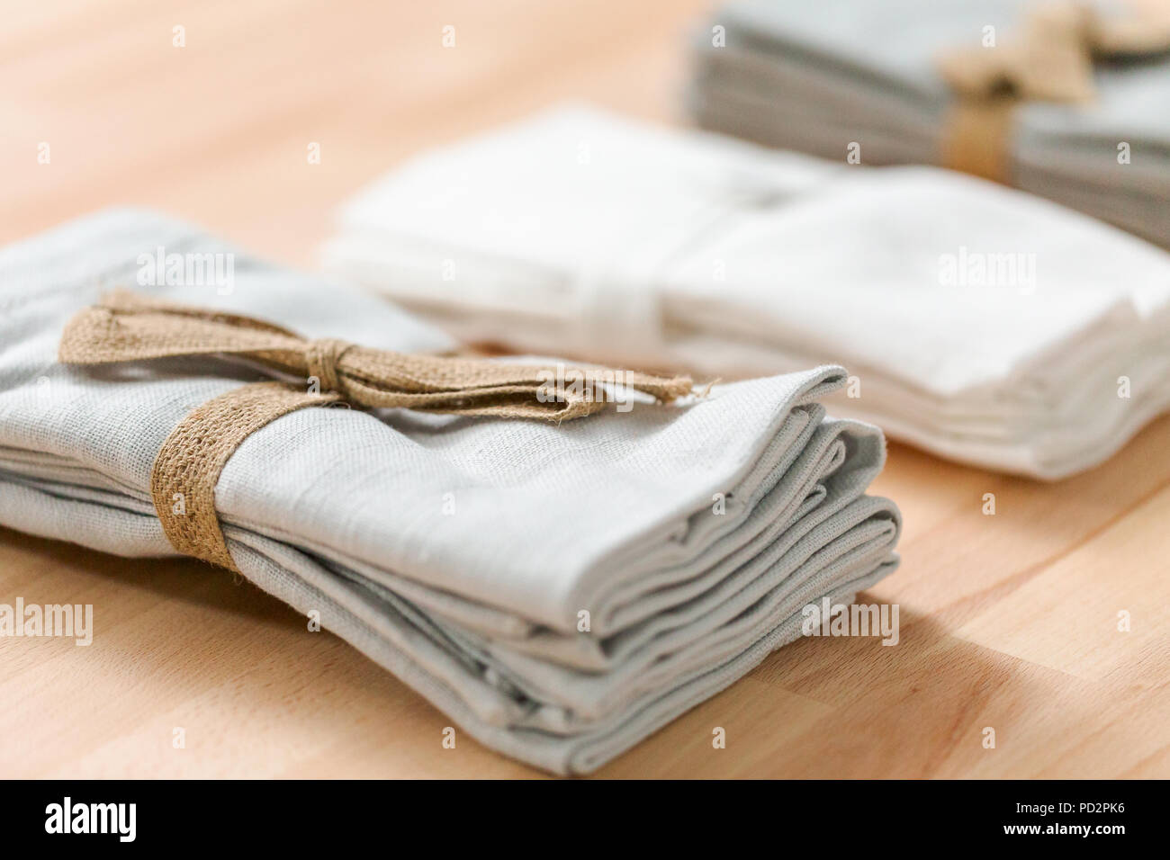 Stack of new linen dinner napkin on the kitchen counter Stock Photo - Alamy
