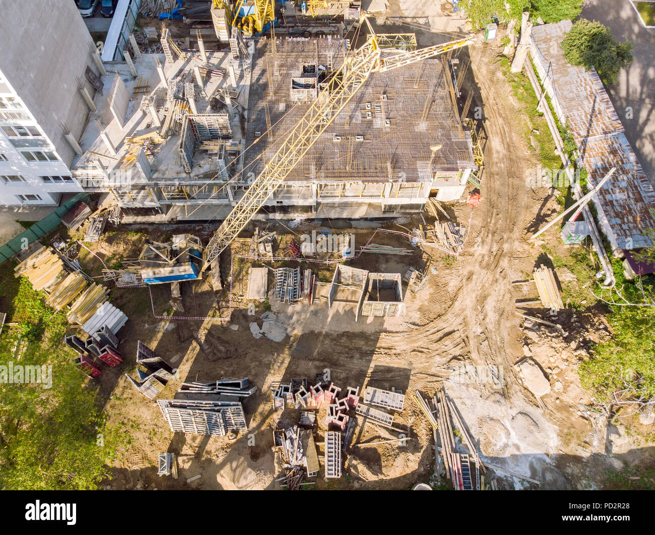 aerial view of building under construction and tower crane. residential ...