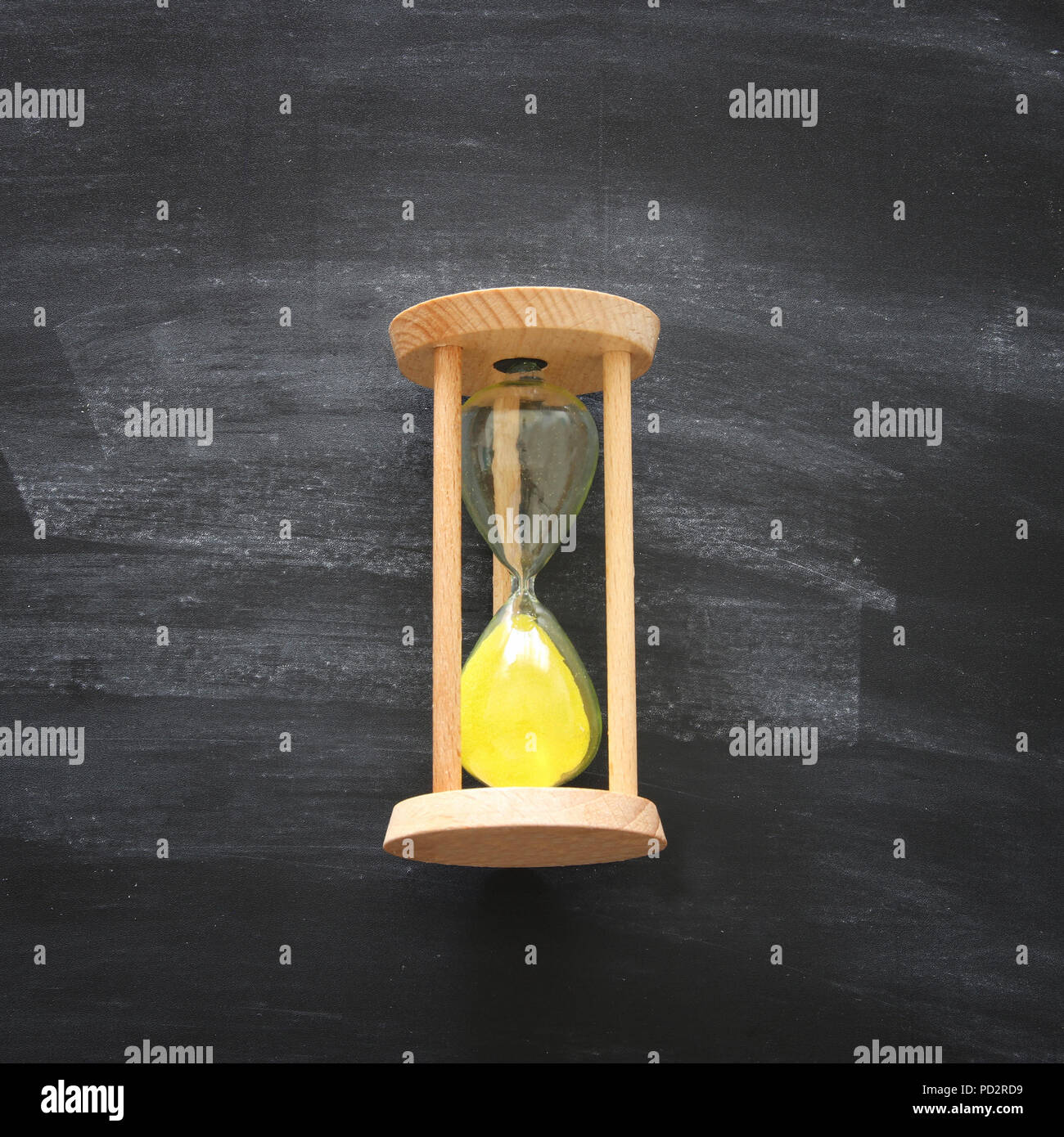 Top view of hourglass over chalkboard background Stock Photo - Alamy