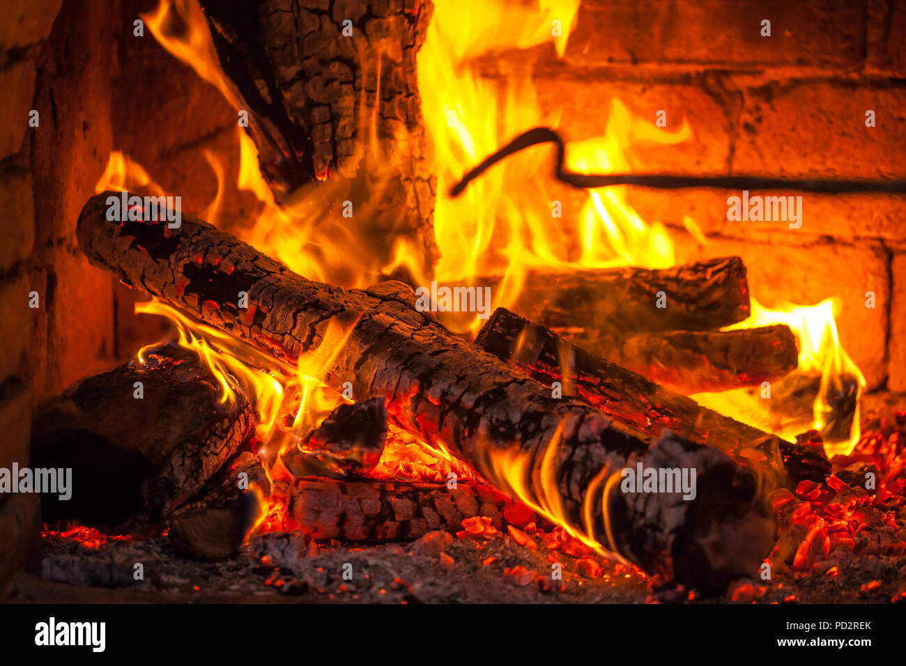 A fire burns in a fireplace, Fire to keep warm Stock Photo - Alamy