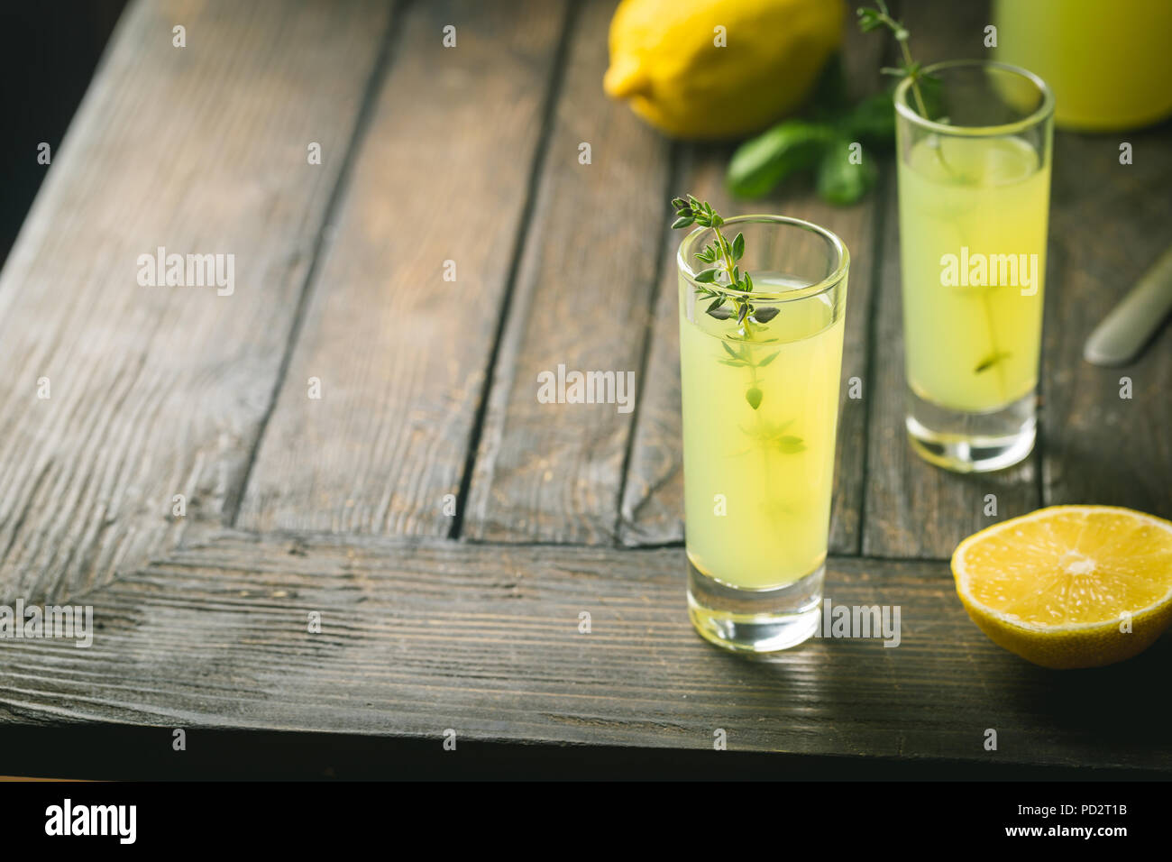 Traditional italian lemon liqueur limoncello and fresh citrus lemon ...