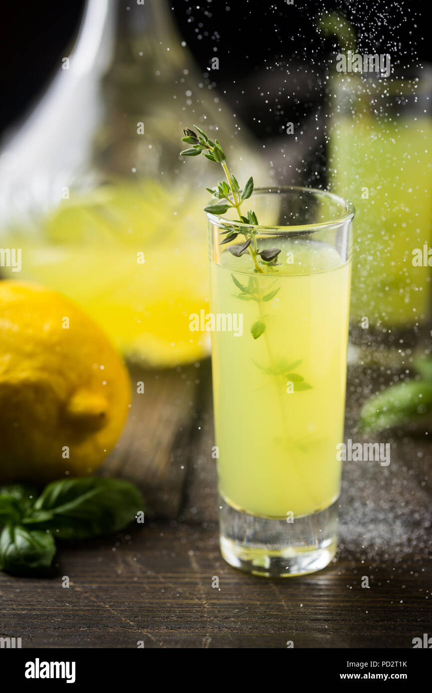 Traditional italian lemon liqueur limoncello and fresh citrus lemon ...