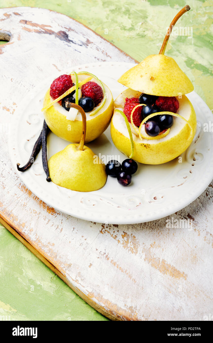 Autumn pear with currant and raspberry filling Stock Photo - Alamy