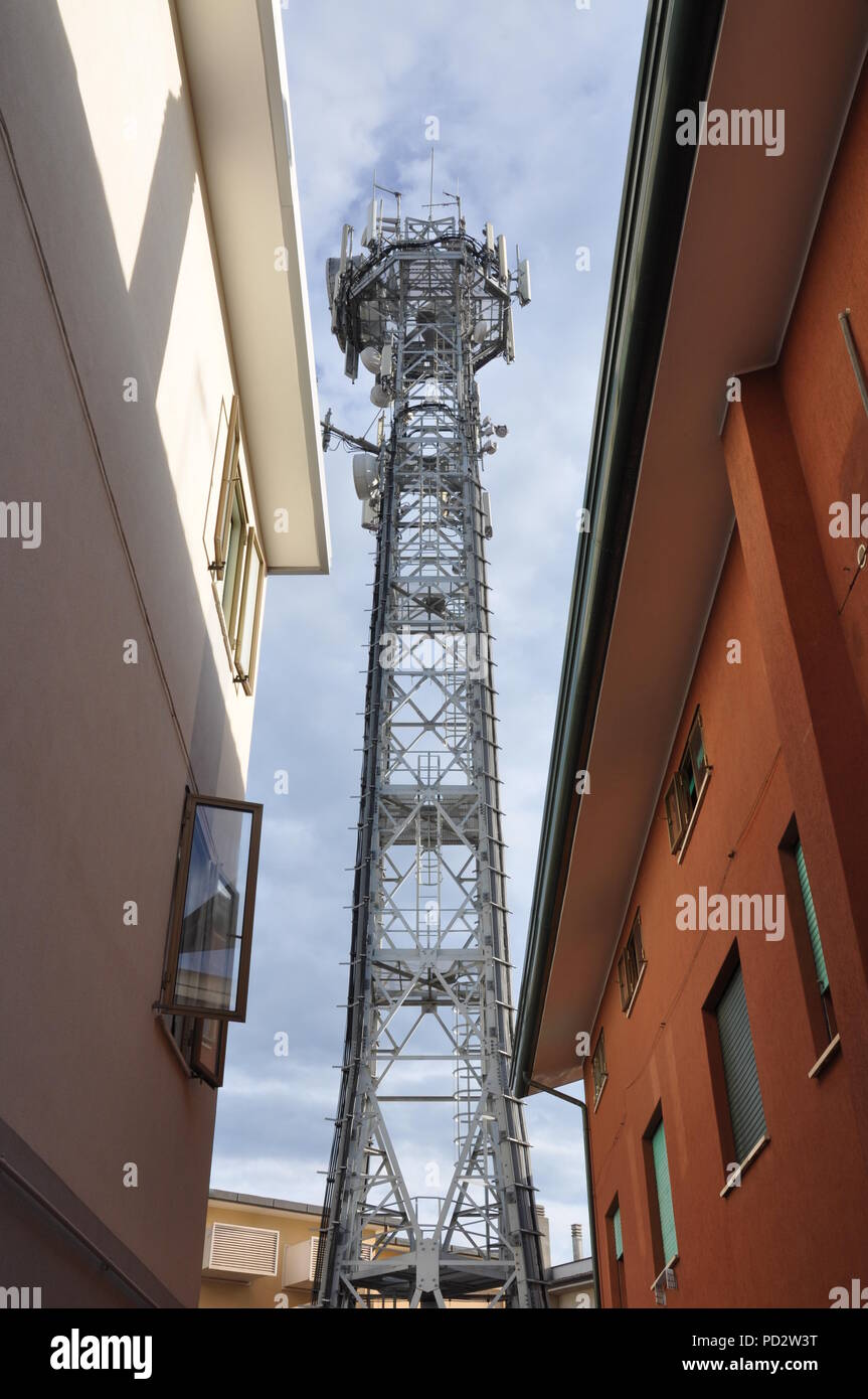 Telecommunication tower in urban space, communication technology Stock ...