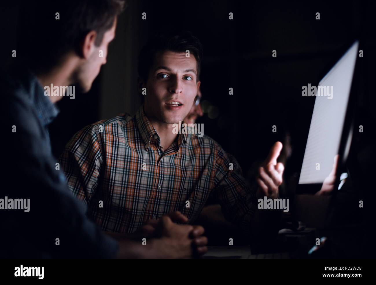 close up.two employees discussing work matters Stock Photo - Alamy