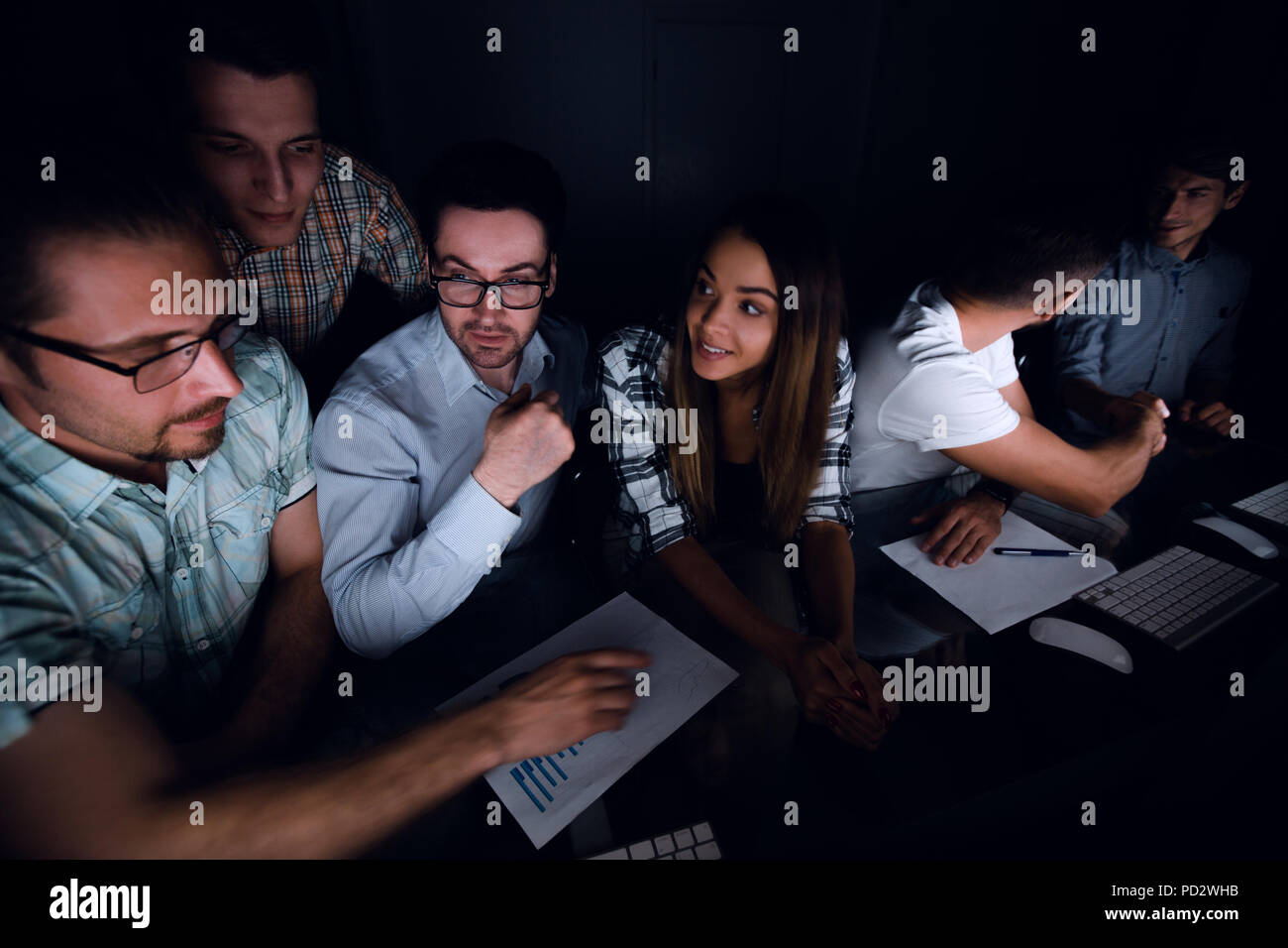business team works in the office at night Stock Photo - Alamy