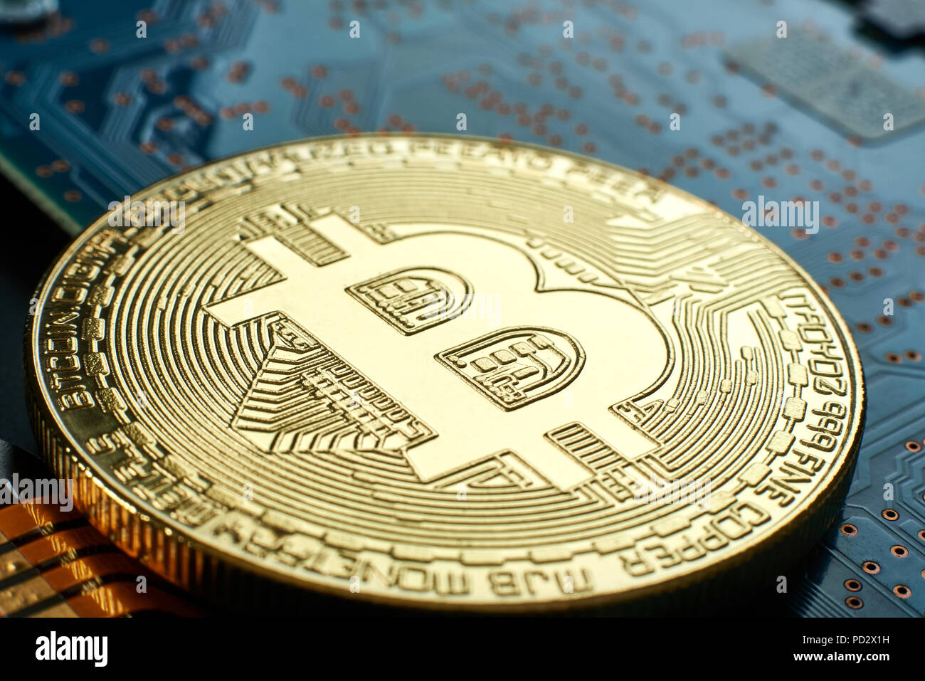Golden Bitcoin on digital pc hard disk.Virtual money Stock Photo - Alamy