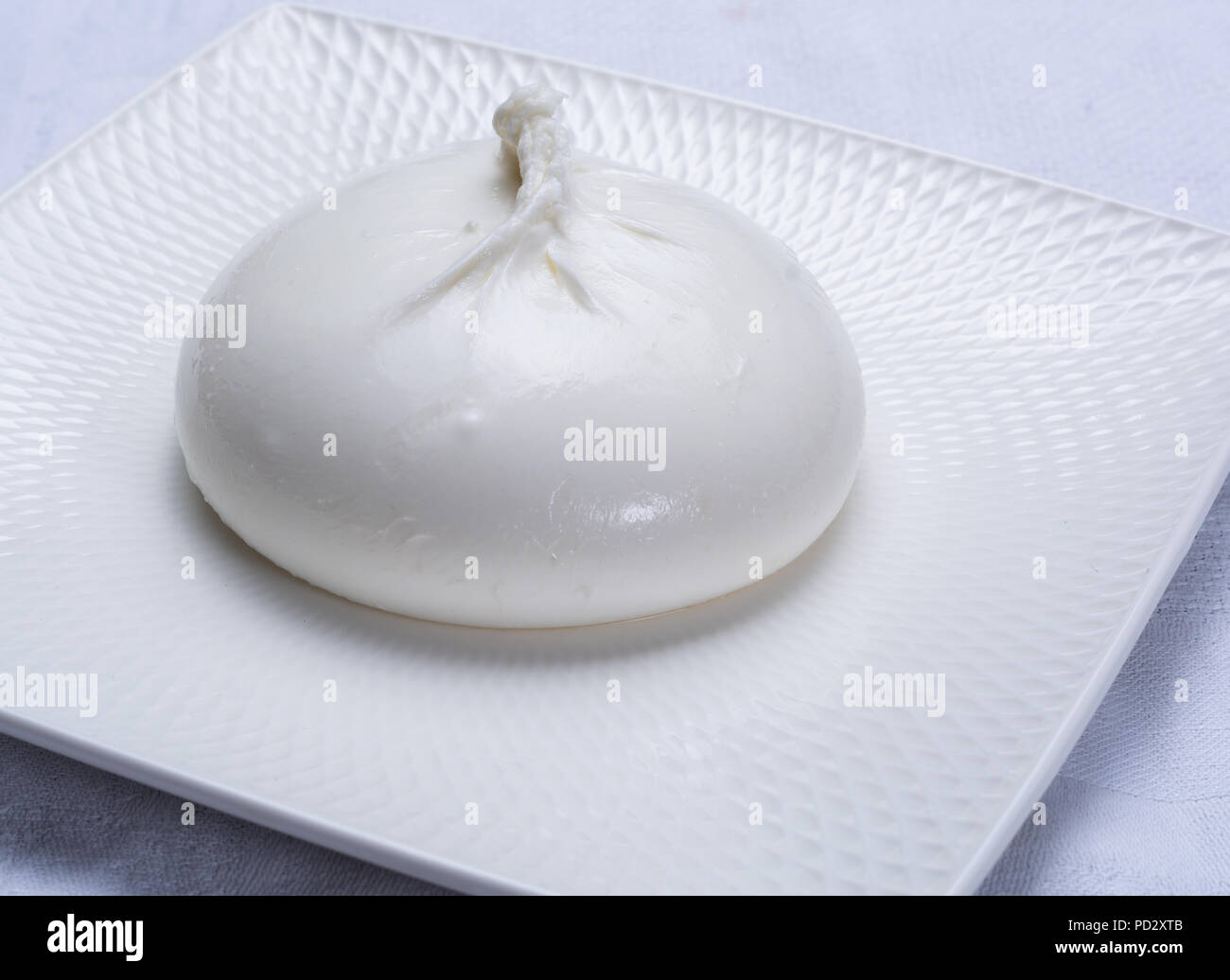Fresh soft white burrata, ball buttery cheese, made from a mix of ...