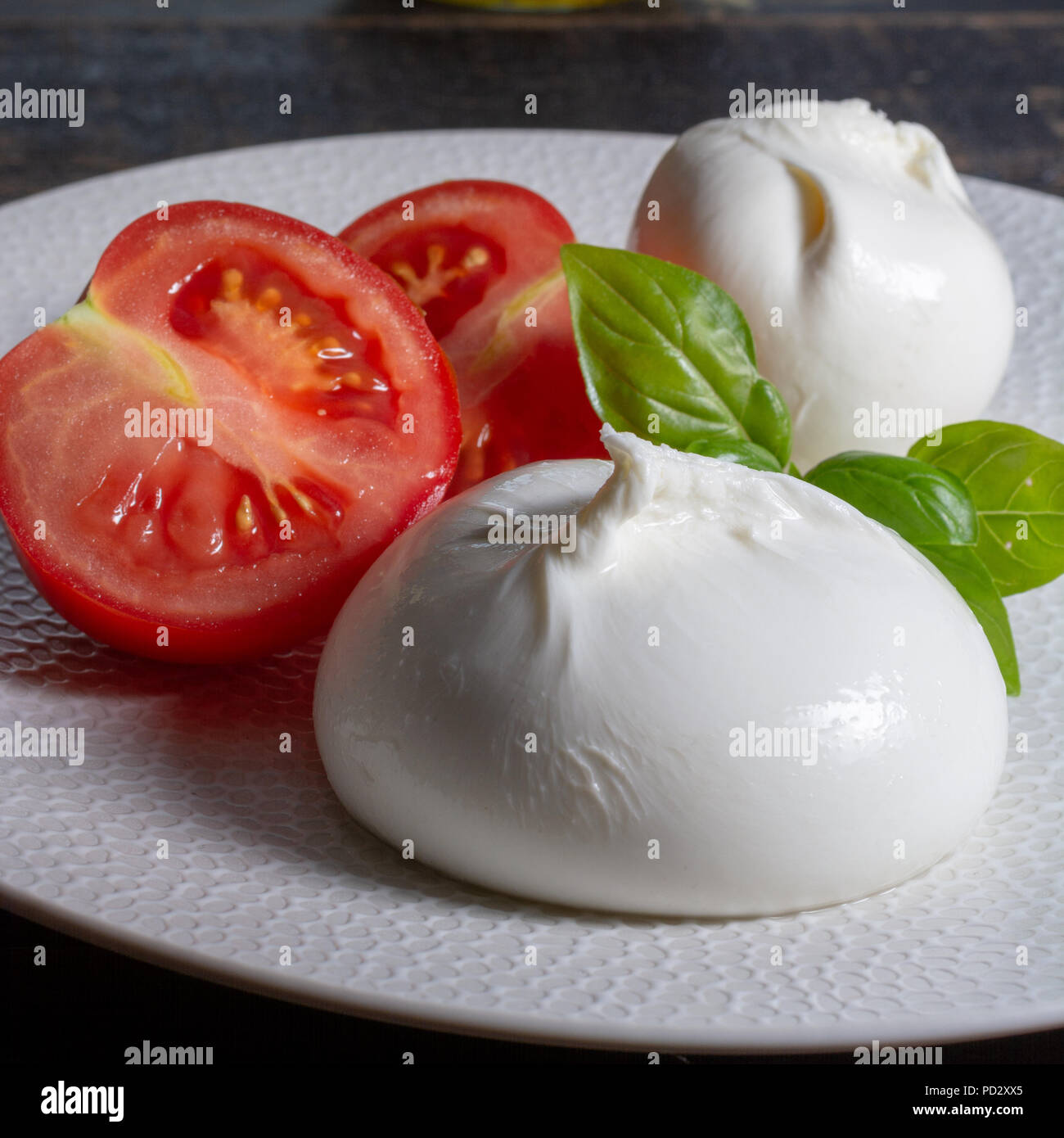 Fresh soft white burrata, ball buttery cheese, made from a mix of ...