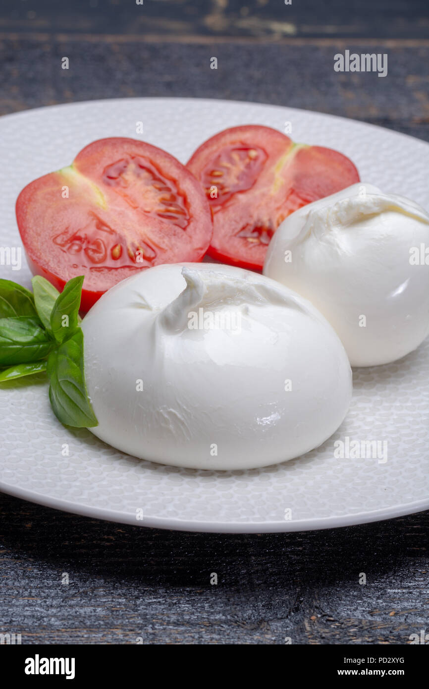 Fresh soft white burrata, ball buttery cheese, made from a mix of ...