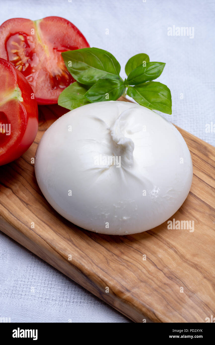 Fresh soft white burrata, ball buttery cheese, made from a mix of ...