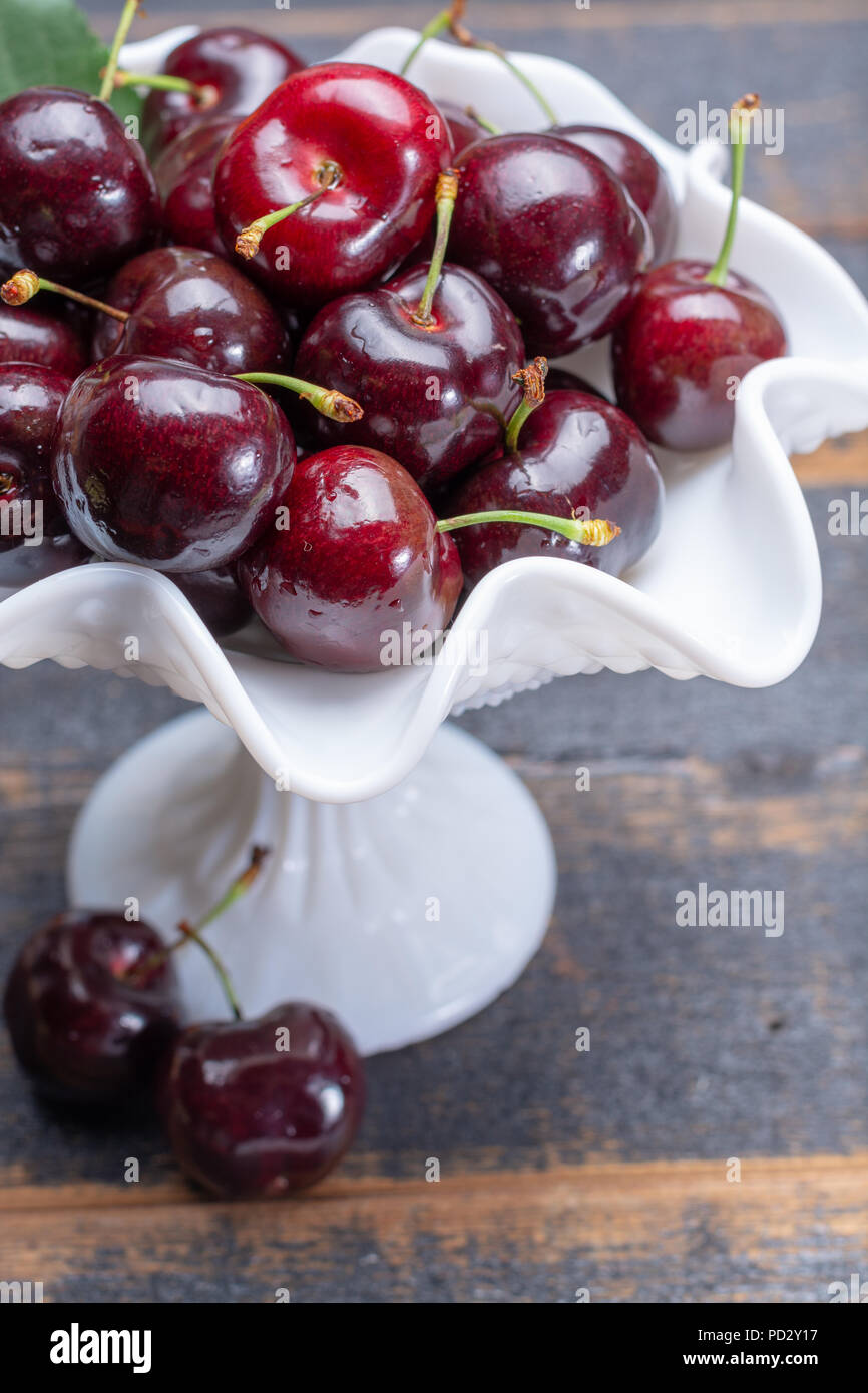 Giant fresh ripe black cherries, new harvest, ready to eat close up ...