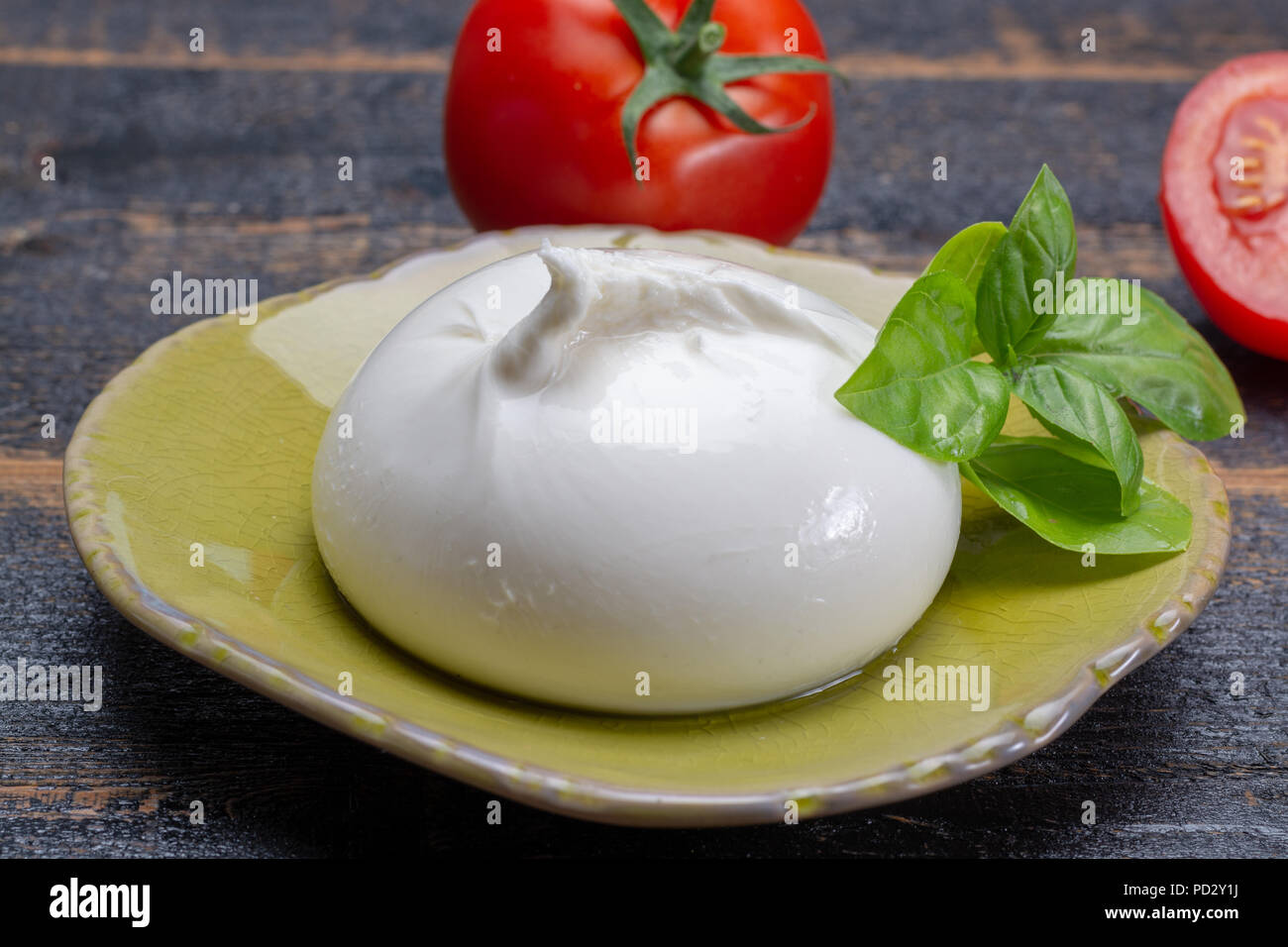 Fresh soft white burrata, ball buttery cheese, made from a mix of ...