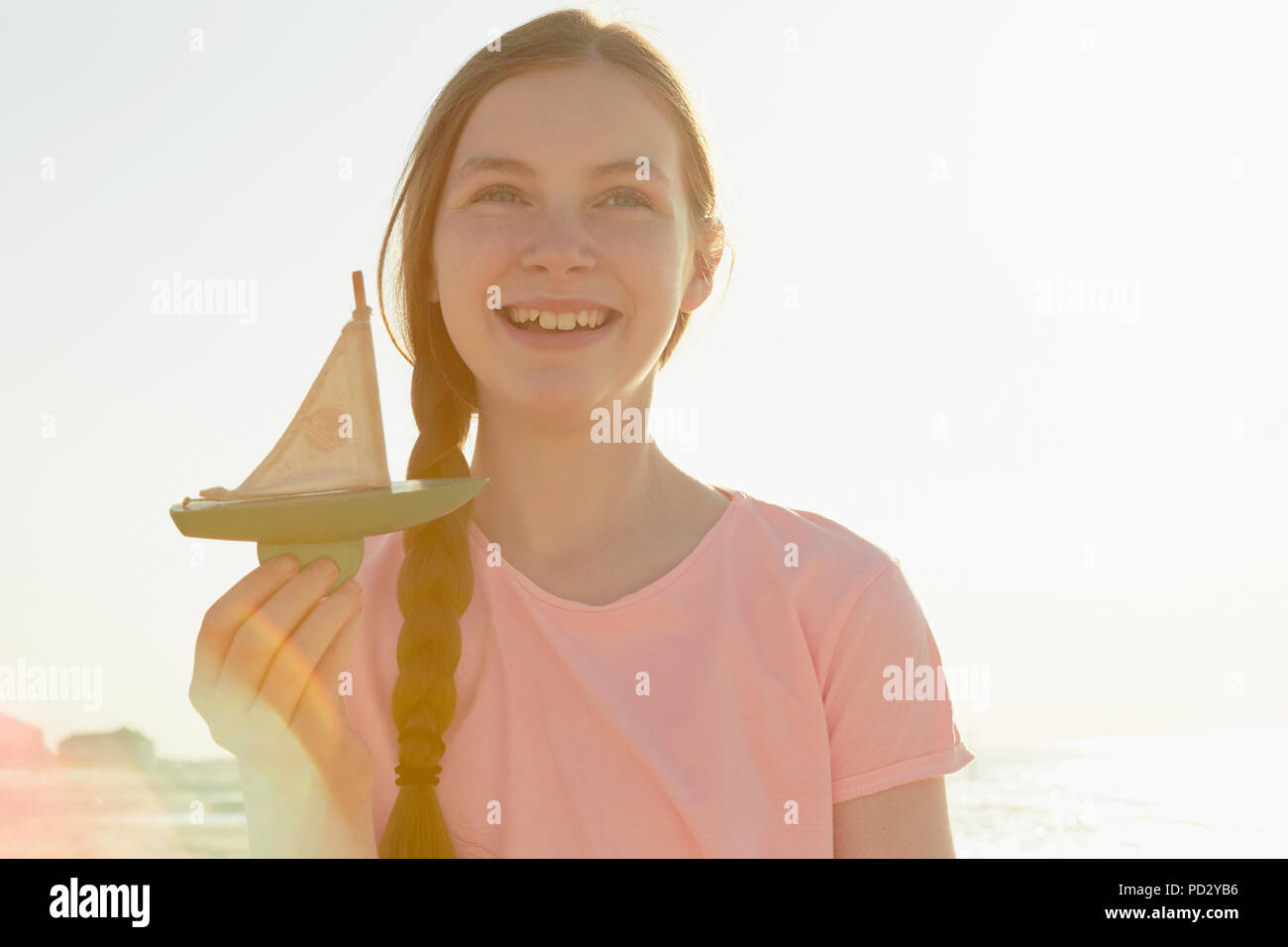 Child holding toy boat hi-res stock photography and images - Alamy