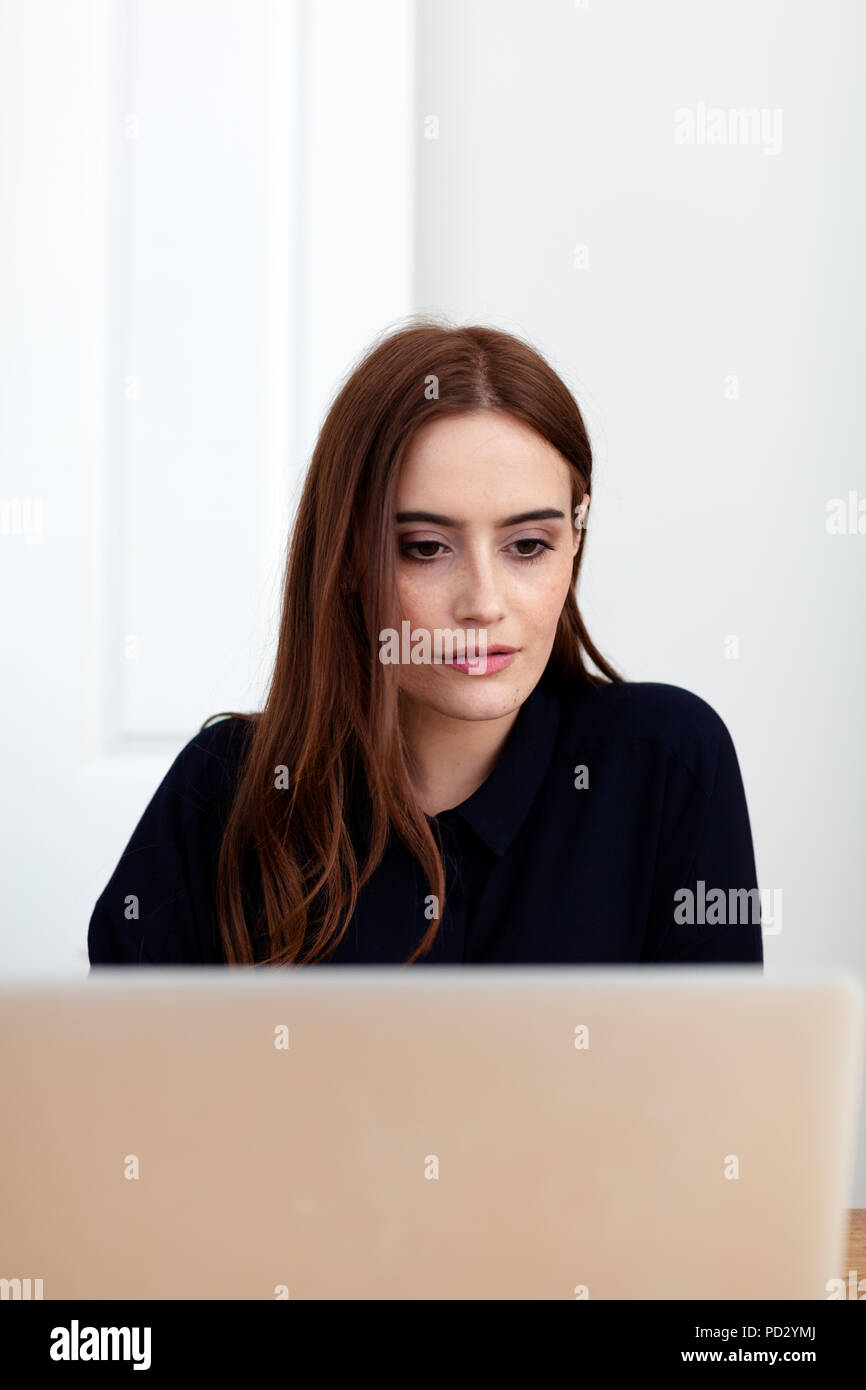 Woman using laptop Stock Photo - Alamy