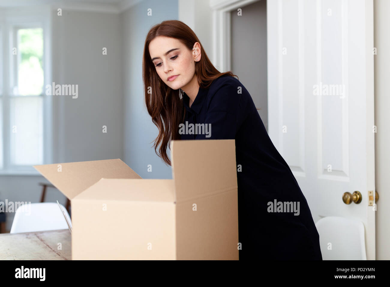 Woman packaging box hi-res stock photography and images - Alamy