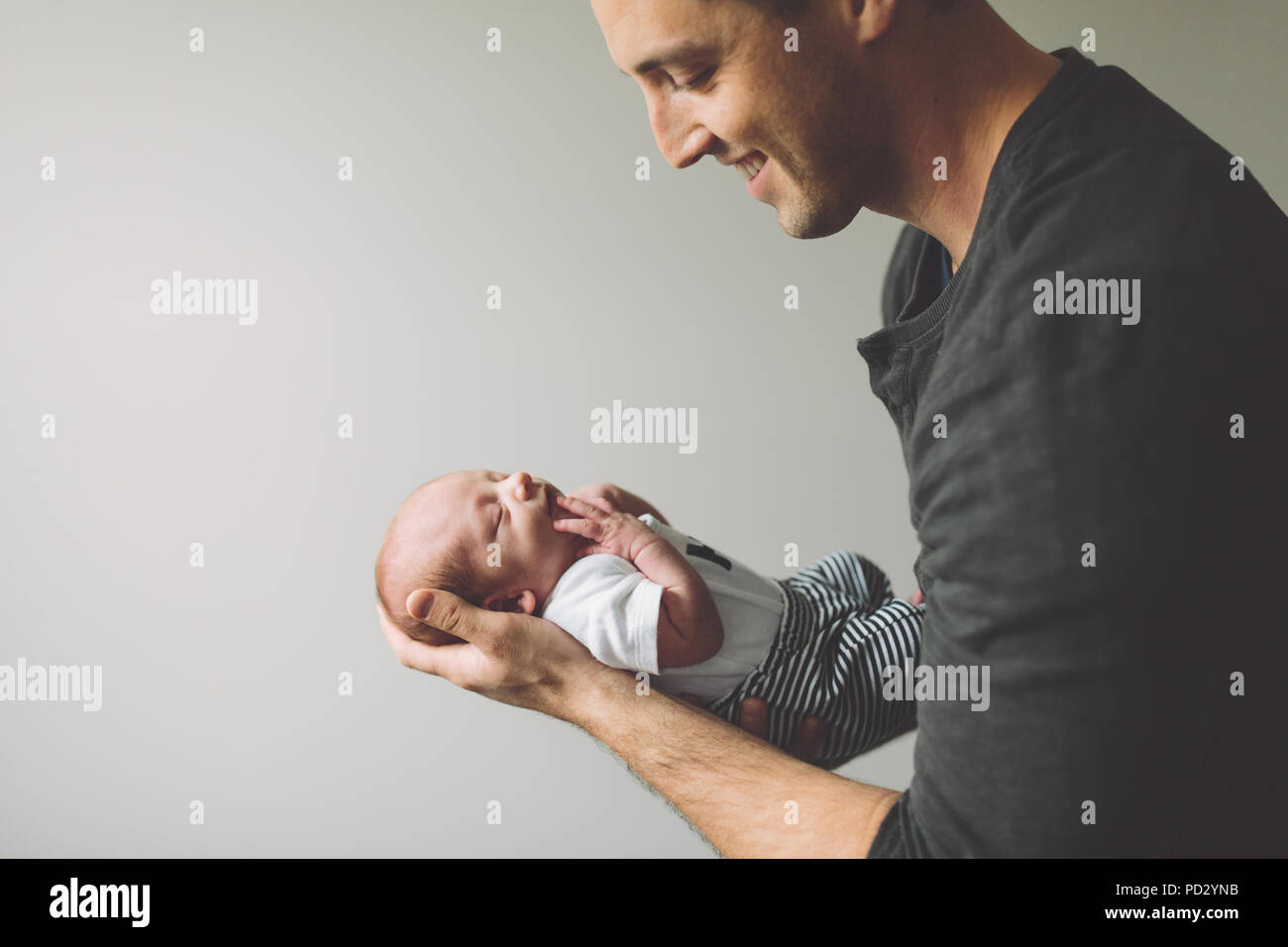 Boy side view holding hi-res stock photography and images - Alamy