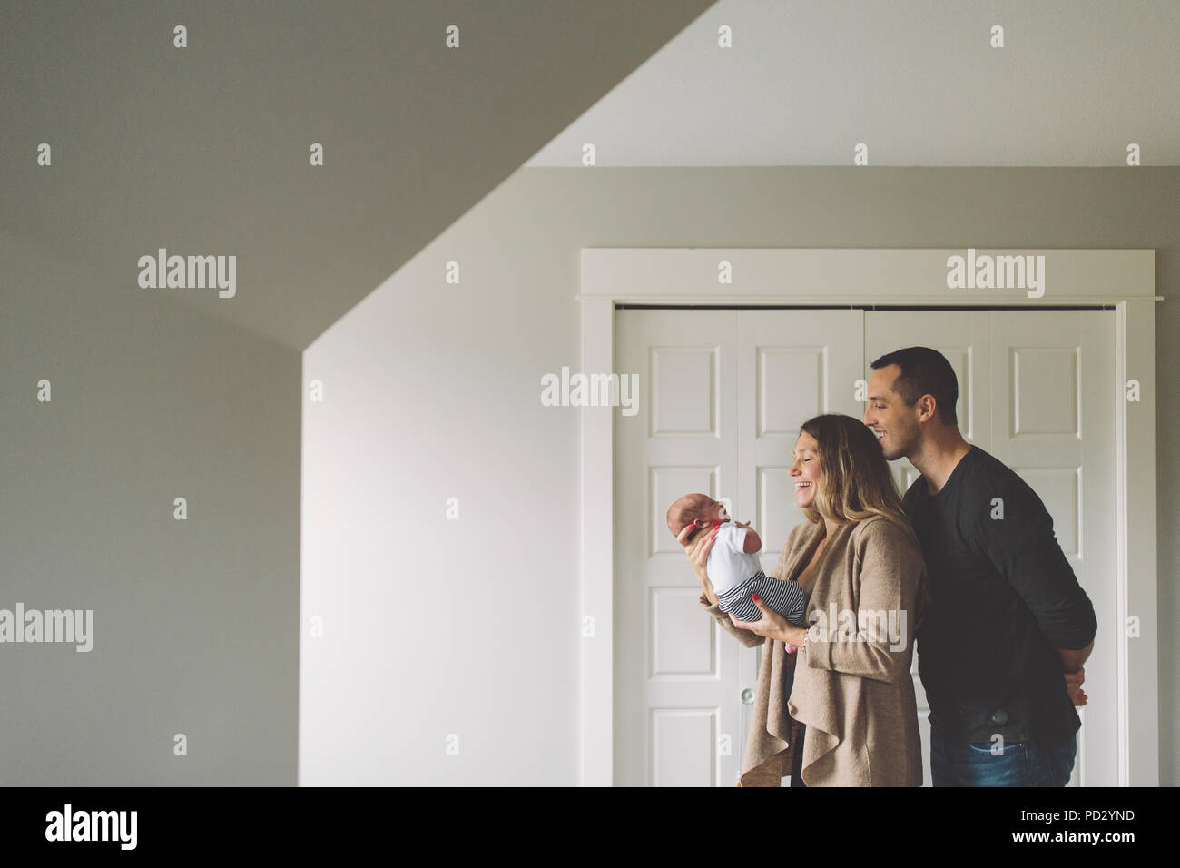 New parents admiring new born baby boy Stock Photo - Alamy