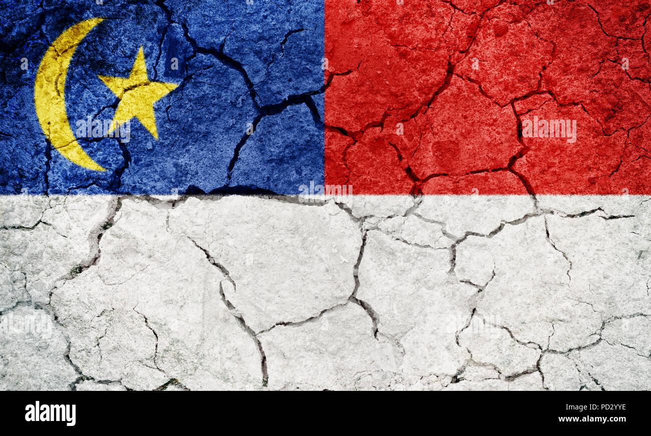 Malacca, state in Malaysia, flag on dry earth ground texture background ...