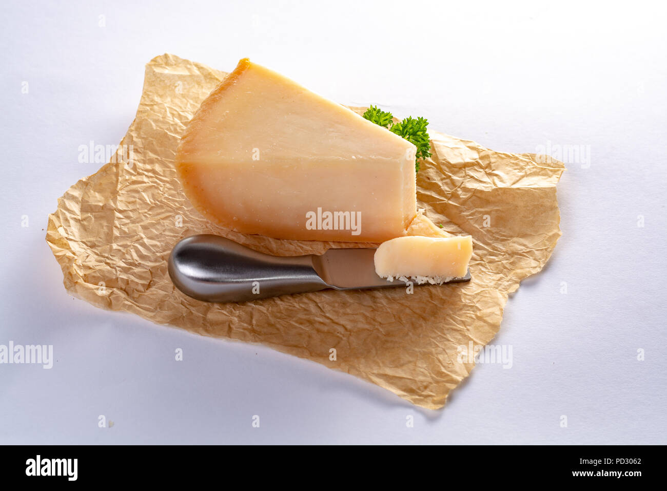 Dutch old Amsterdam cheese, made from goat milk on white background ...