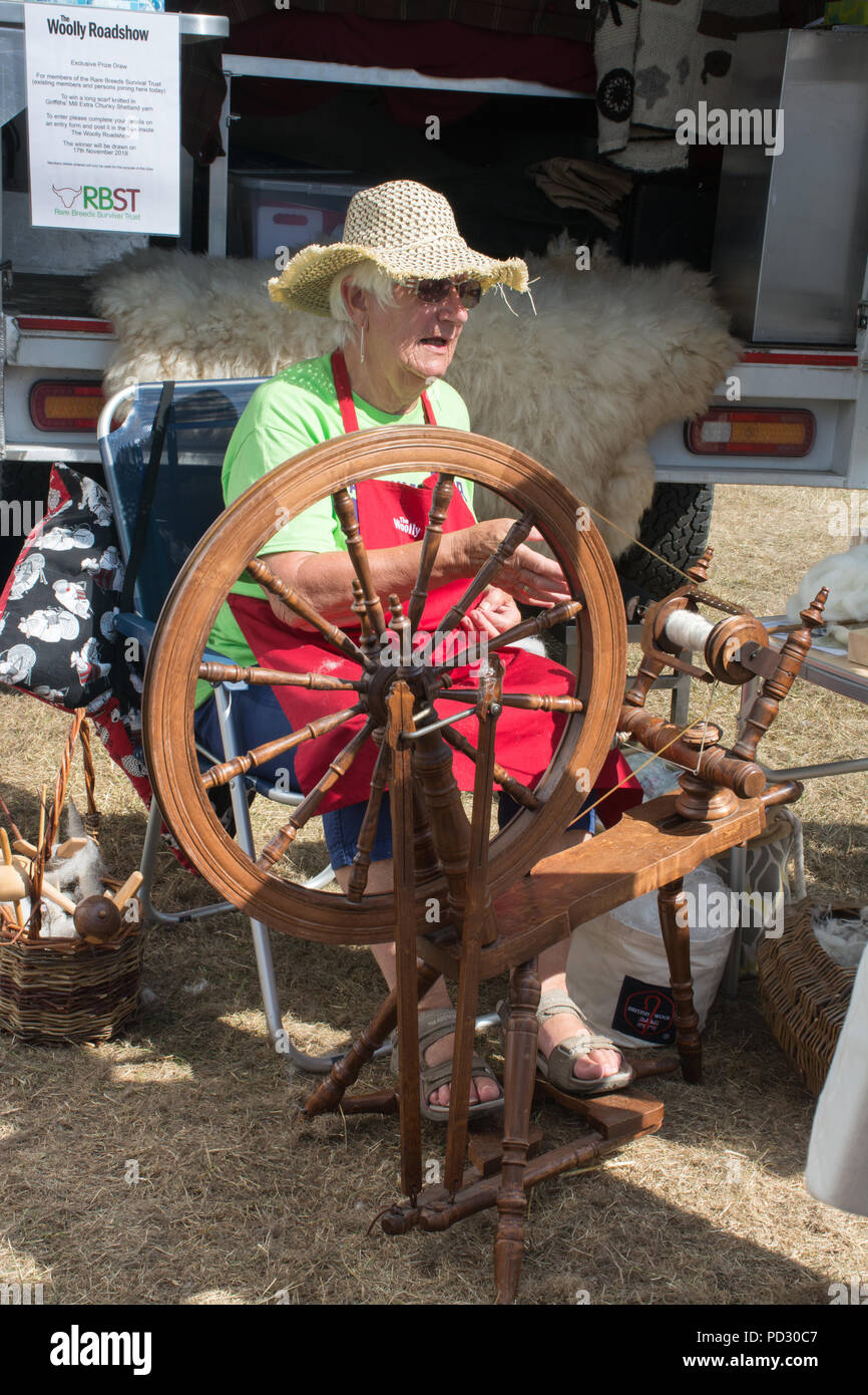 Woman demonstrating the craft of spinning wool at the Countryfile Live ...