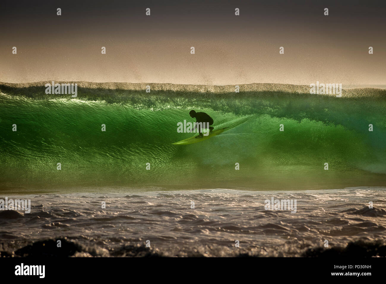 Surfer surfing on barreling wave, Crab Island, Doolin, Clare, Ireland ...