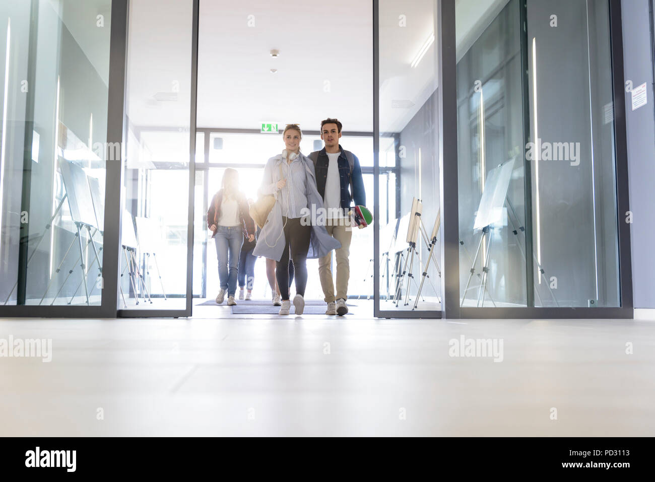 Man woman entering building hi-res stock photography and images - Alamy