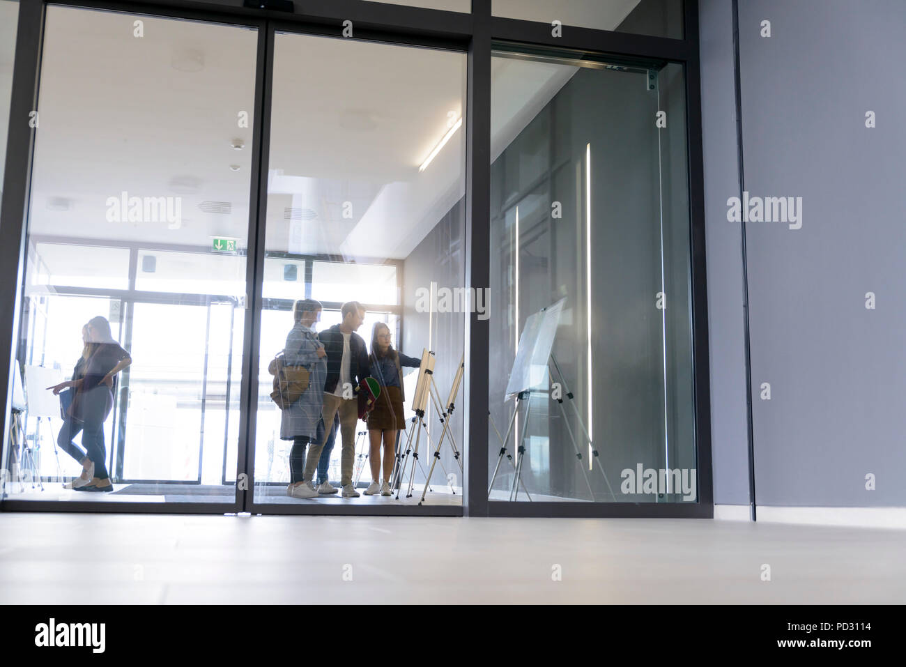 Man and woman reading notice board hi-res stock photography and images ...
