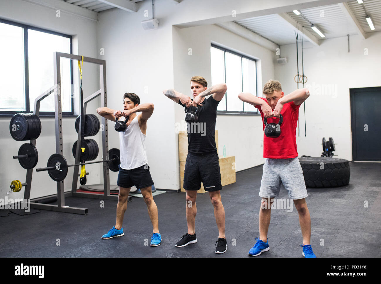 Three men in gym hi-res stock photography and images - Alamy