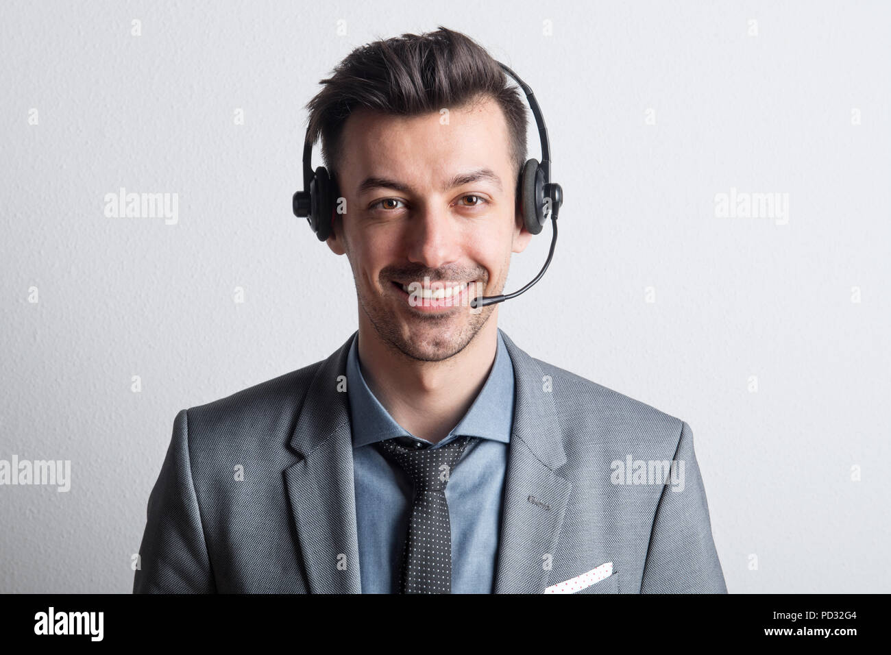 Portrait of a young man with headset in a studio. Copy space Stock ...