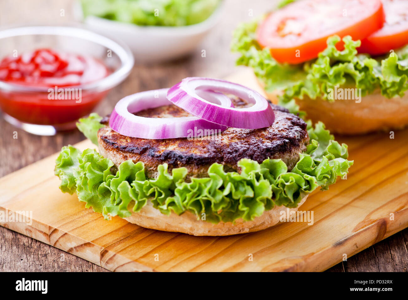 Homemade beef burger with lettuce and tomato Stock Photo - Alamy