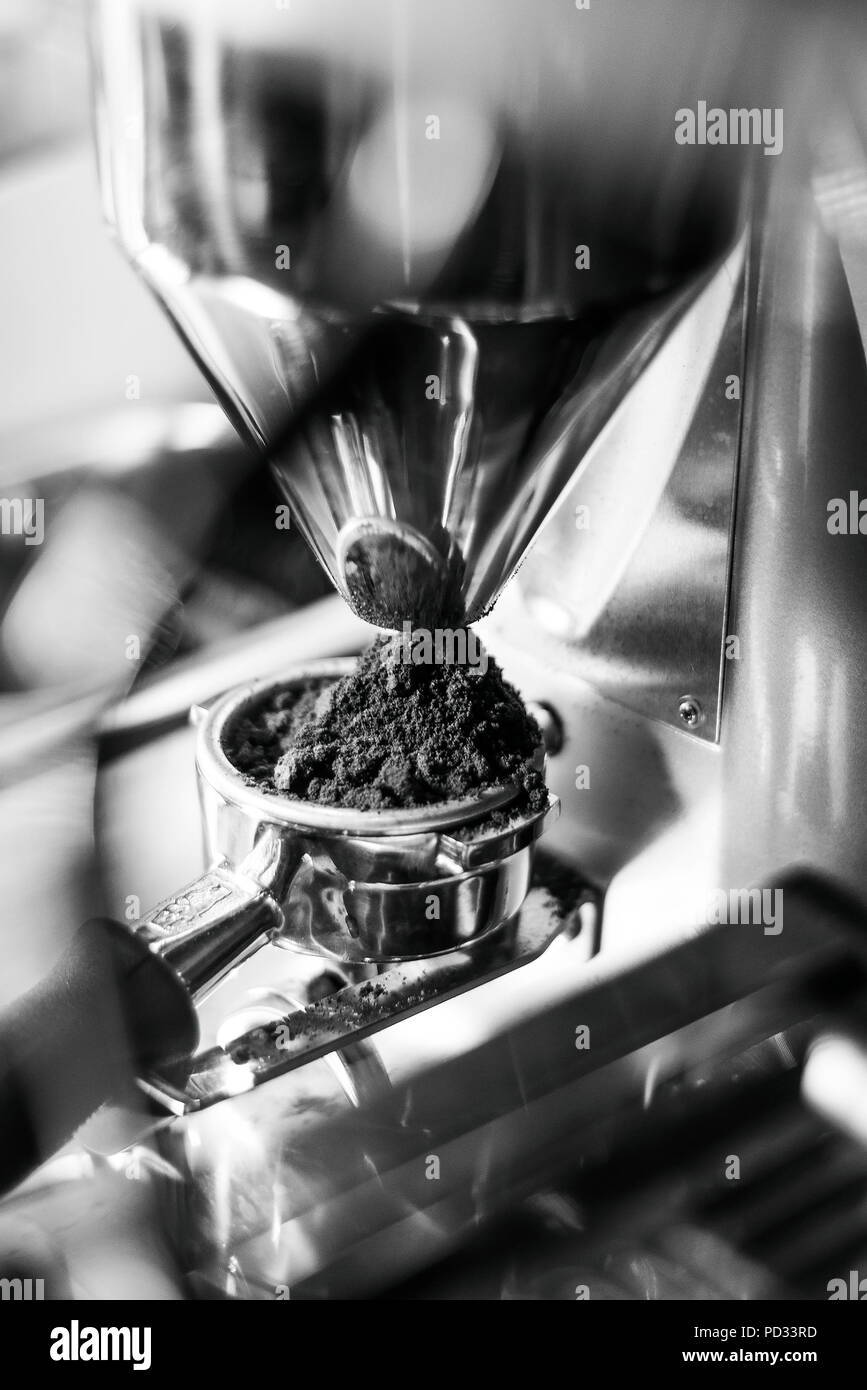 making espresso coffee BW black and white close up detail with modern ...