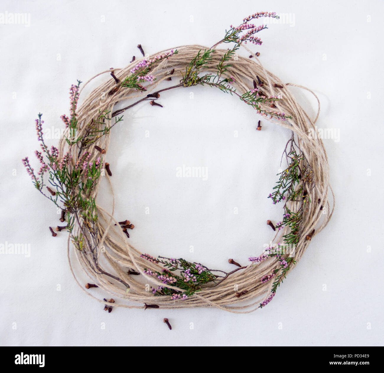 Hessian, twine, jute string wreath with purple and green heather (erica ...
