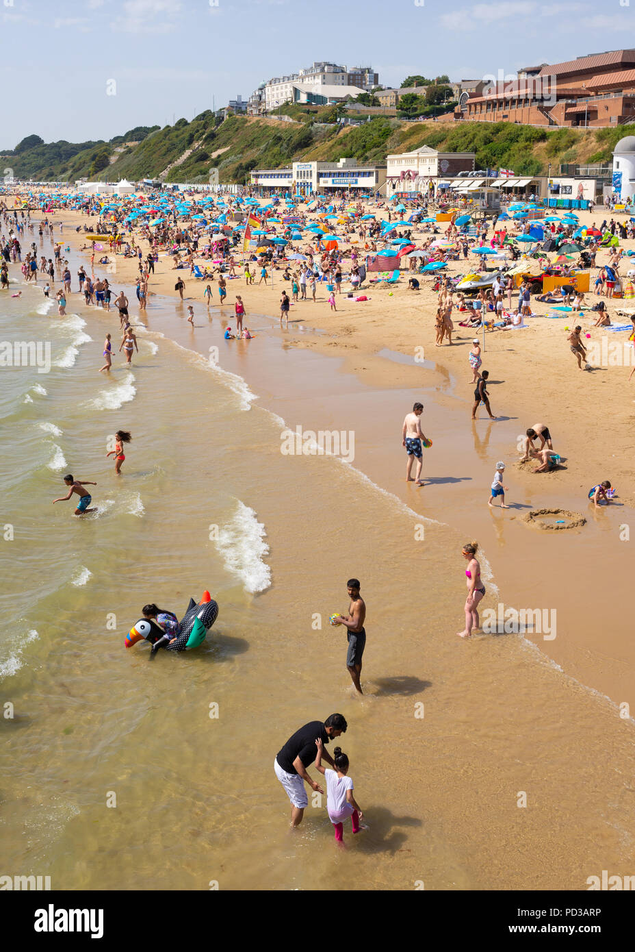 People in the sea and on the beach during summer heatwave 2018 ...