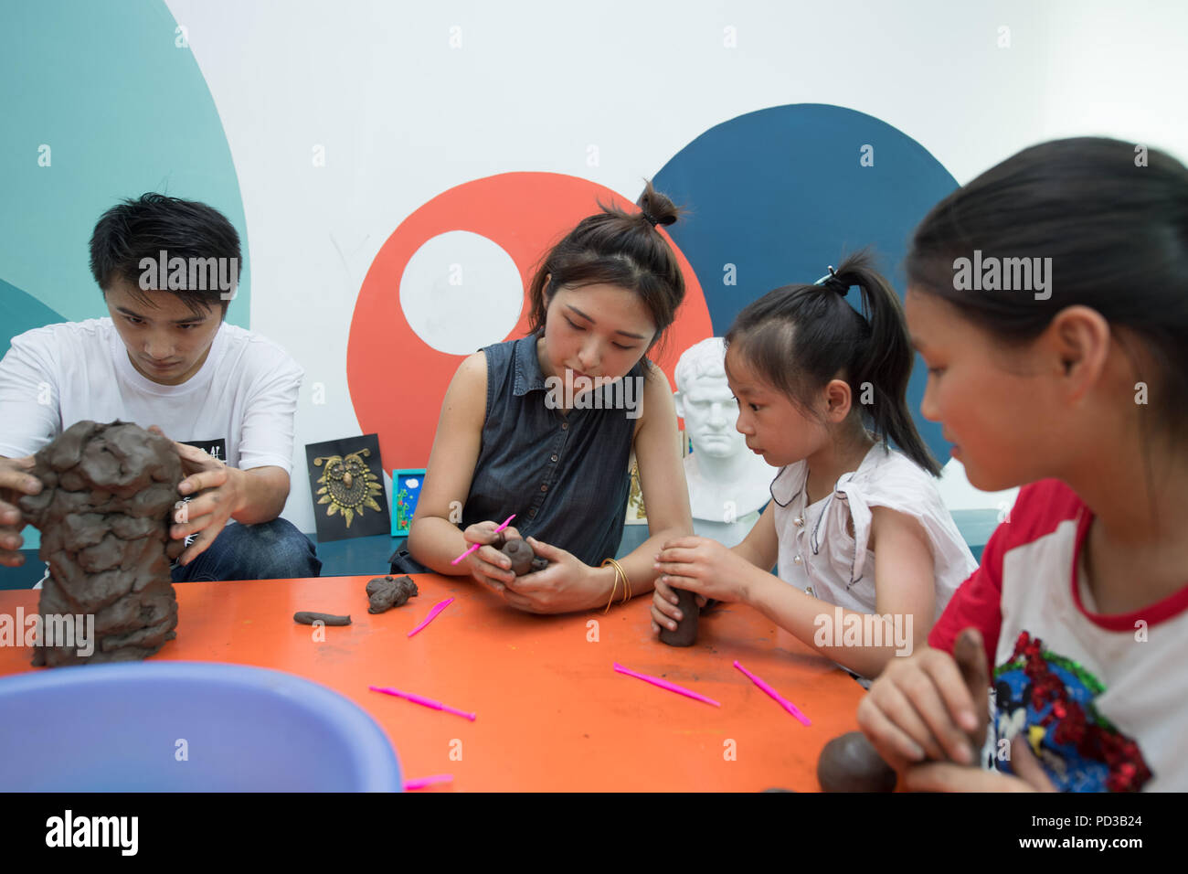 (180806) -- HUZHOU, Aug. 6, 2018 (Xinhua) -- Xu Mingsheng (1st L) and ...