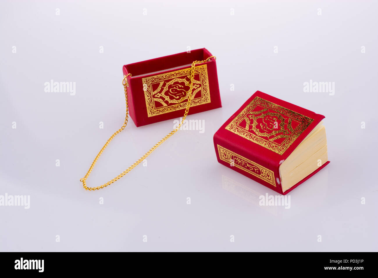 The Holy Quran on a white background Stock Photo - Alamy