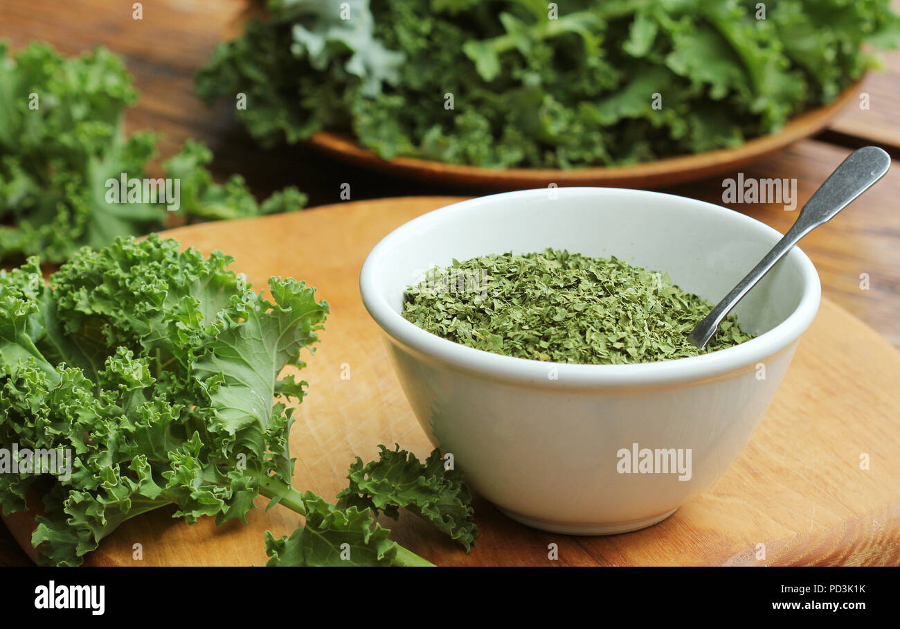 Chopped dry kale leaves on rustic background Stock Photo - Alamy