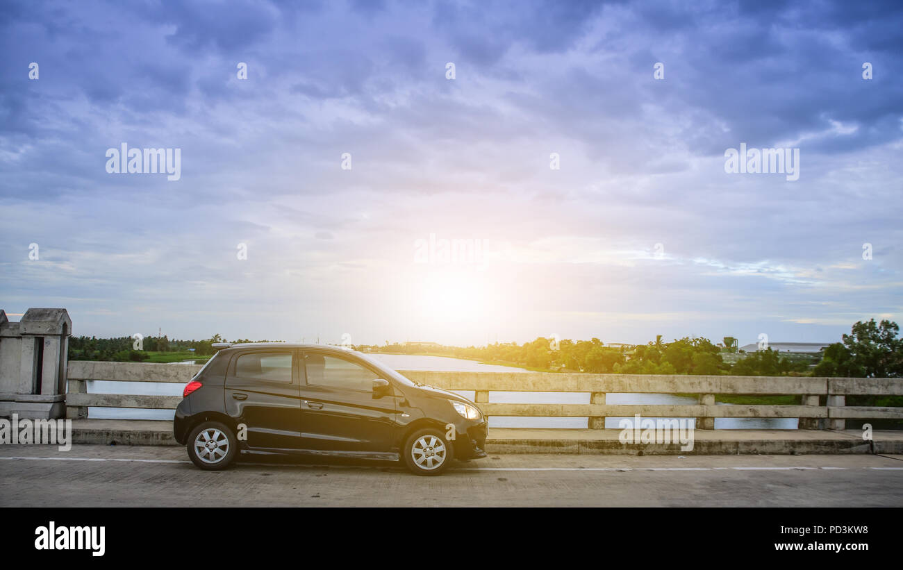 Car driving on road sunlight background,car on road in city Stock Photo ...
