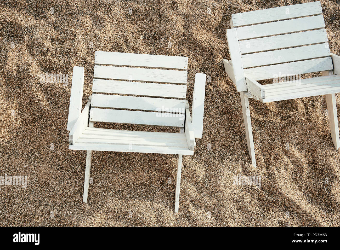 Top view of wooden chairs on a sandy beach Stock Photo - Alamy