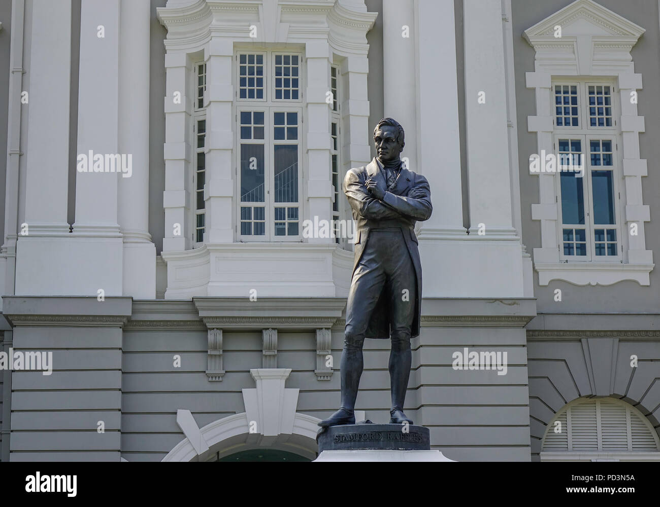 Singapore - Feb 9, 2018. Statue of Sir Stamford Raffles in front of Victoria Theatre and Concert ...