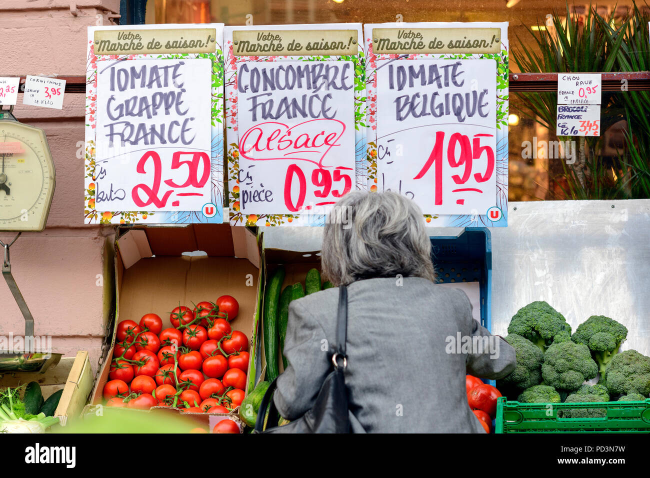 Woman shopping for vegetables at grocery shop stall, Strasbourg, Alsace ...