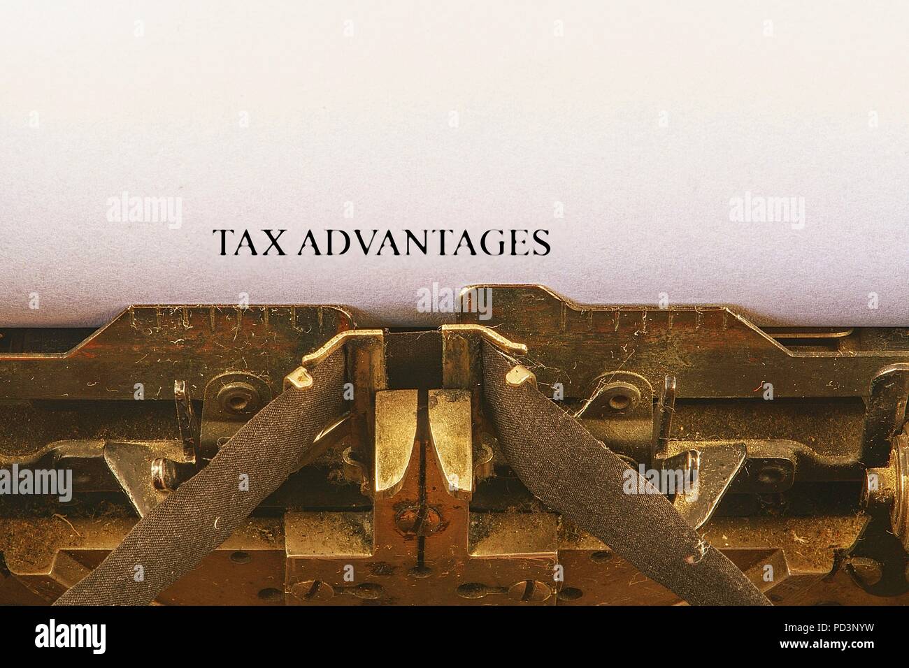 Closeup on vintage typewriter. Front focus on letters making TAX ...