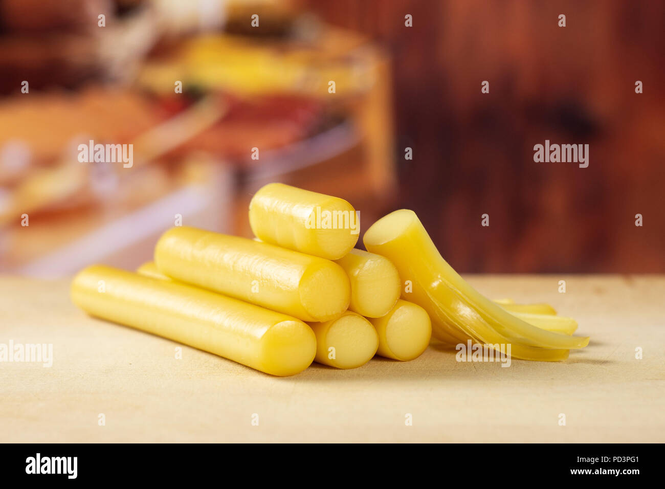 Lot of whole one piece of smoked slovak string cheese stick with rustic ...