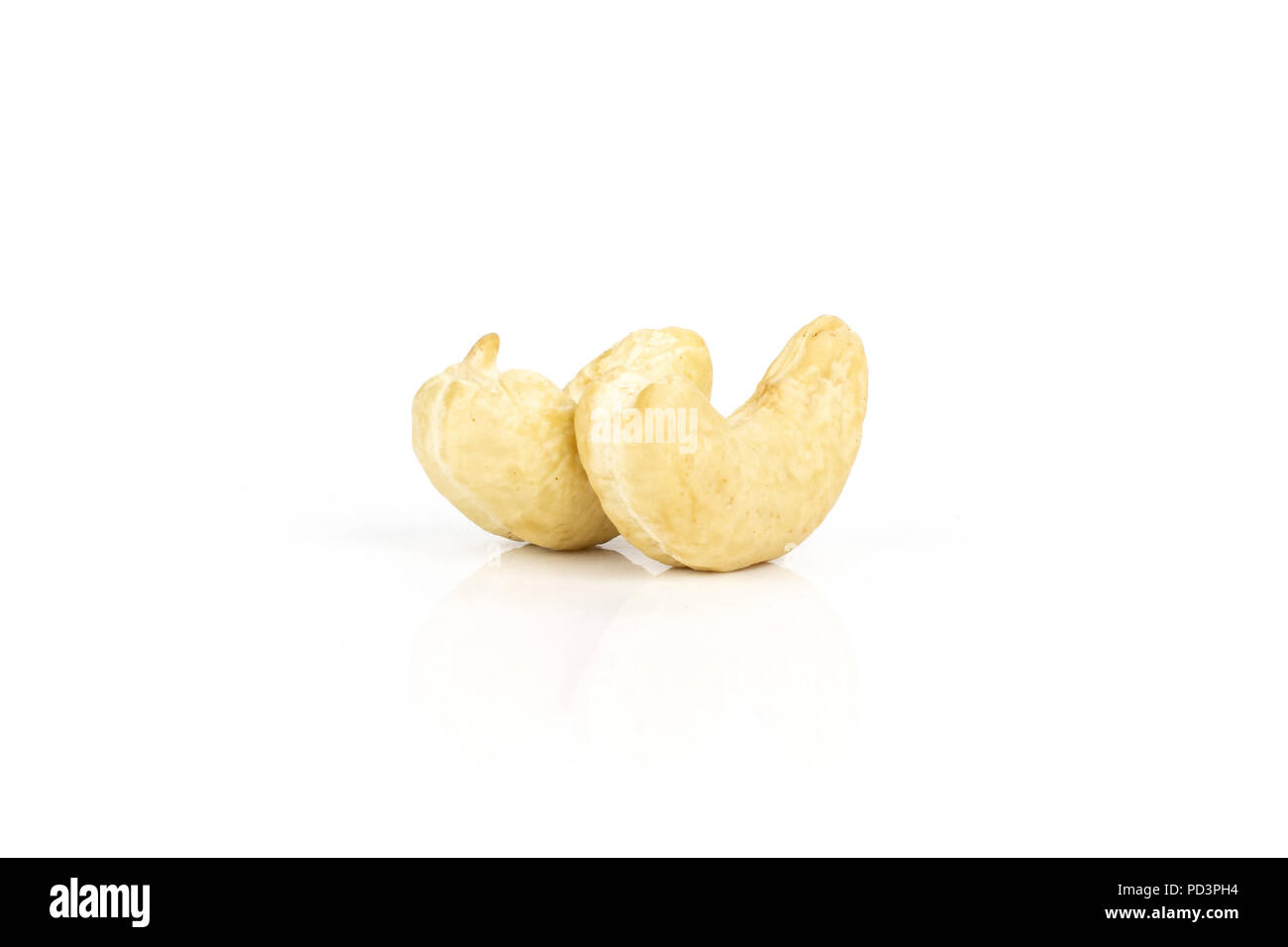 Group of two whole raw cashew nut isolated on white background Stock ...