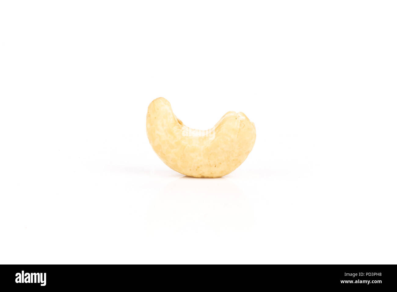 One whole fresh raw cashew nut isolated on white background Stock Photo ...