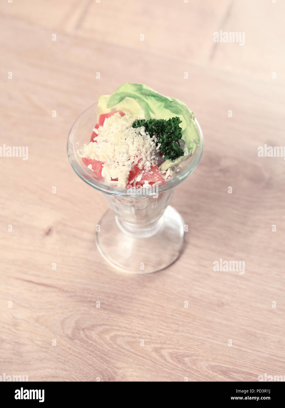 salad-cocktail with the chicken and vegetables on wooden background ...