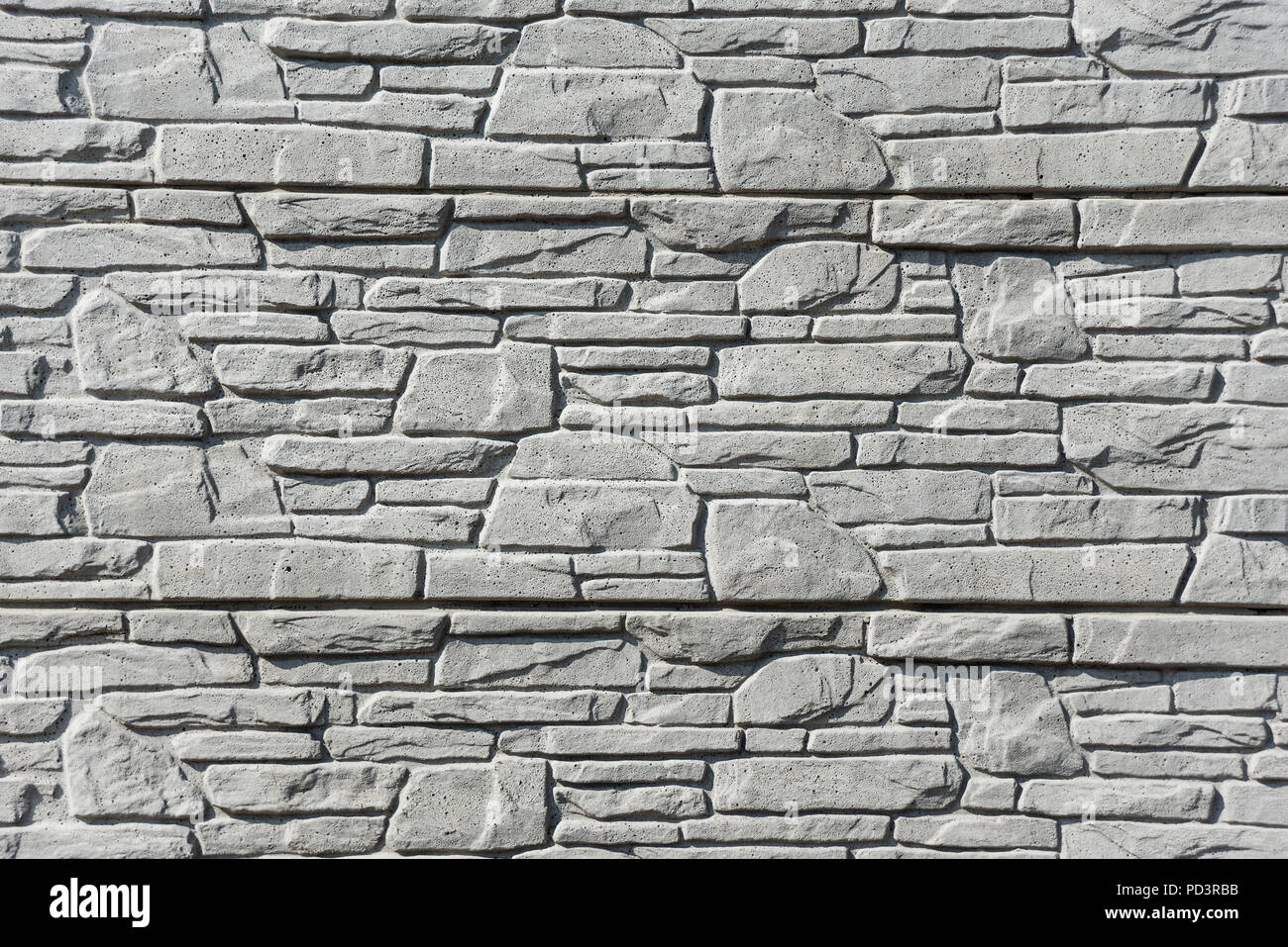 Texture of an old rough gray stone wall close-up Stock Photo - Alamy