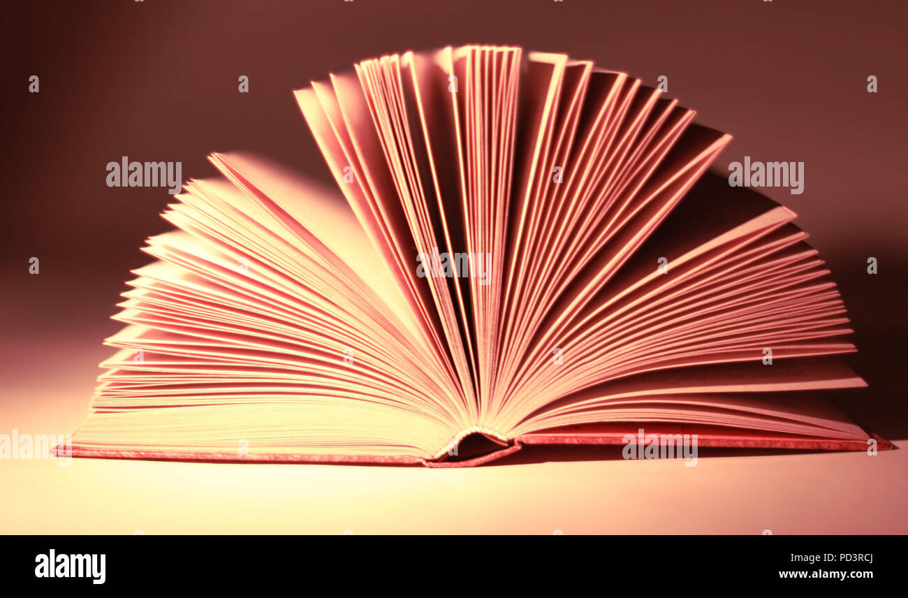 open book.isolated on a yellow background.p Stock Photo - Alamy